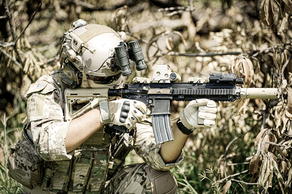 Soldier in full US MARSOC armed with assault rifle run through the ...