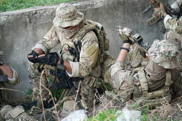 Soldier in full US MARSOC armed with assault rifle run through the ...