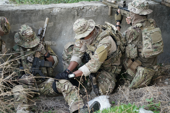 Soldier in full US MARSOC armed with assault rifle run through the ...
