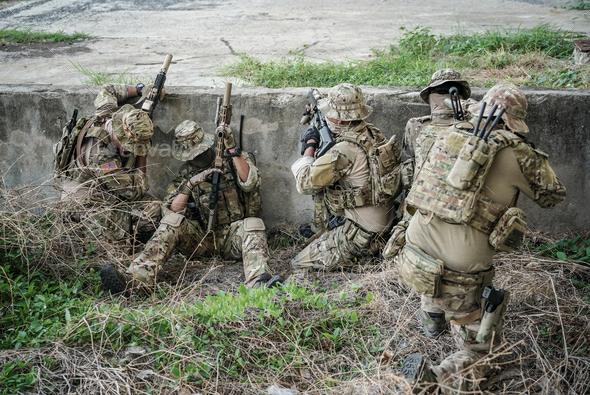 Soldier in full US MARSOC armed with assault rifle run through the ...