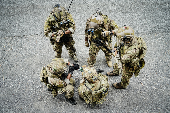 Soldier in full US MARSOC armed with assault rifle run through the ...
