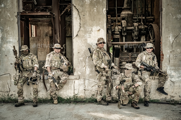Soldier in full US MARSOC armed with assault rifle run through the ...