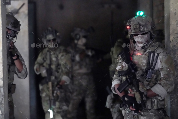 Soldier in full US MARSOC armed with assault rifle run through the ...