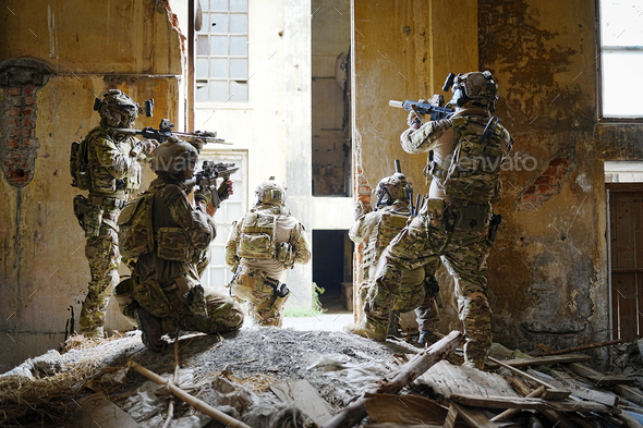 Soldier in full US MARSOC armed with assault rifle run through the ...
