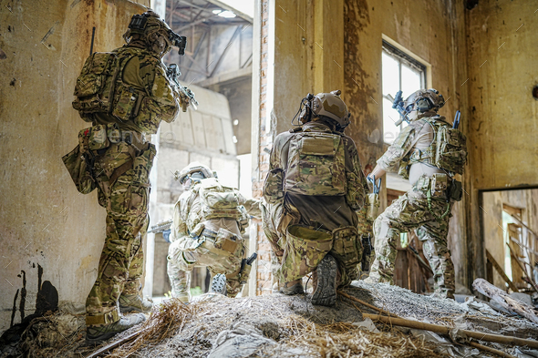 Soldier in full US MARSOC armed with assault rifle run through the ...