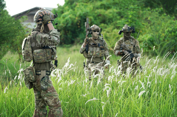 Soldier in full US MARSOC armed with assault rifle run through the ...