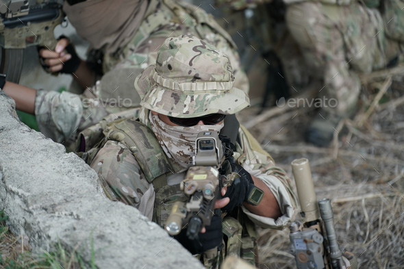 Soldier in full US MARSOC armed with assault rifle run through the ...