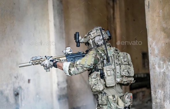 Soldier in full US MARSOC armed with assault rifle run through the ...