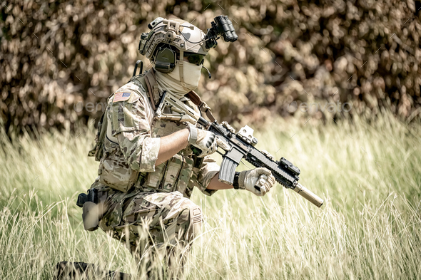 Soldier in full US MARSOC armed with assault rifle run through the ...