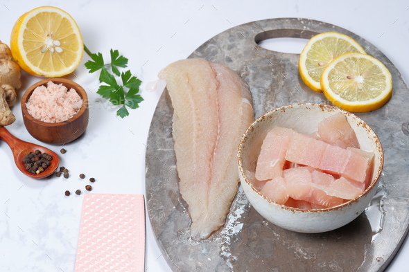 Fresh Pangasius dory Fish Fillet with ingredient on white background ...