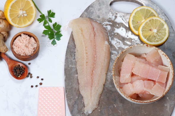 Fresh Pangasius dory Fish Fillet with ingredient on white background ...