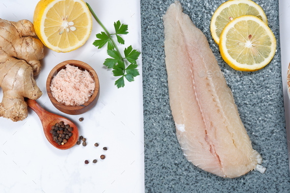 Fresh Pangasius dory Fish Fillet with ingredient on white background ...