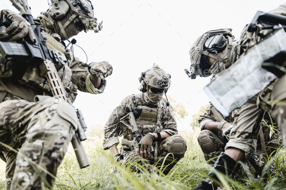 Soldiers running forward and attacking enemy during military operation ...
