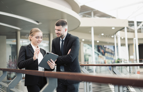 Business people having fun and chatting at the workplace outside the ...