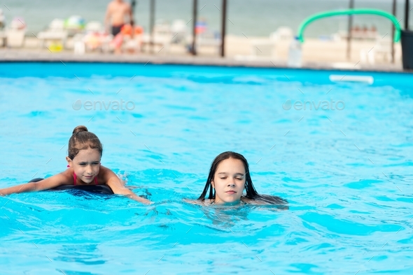 Two little sisters girls are swimming Stock Photo by YouraPechkin ...