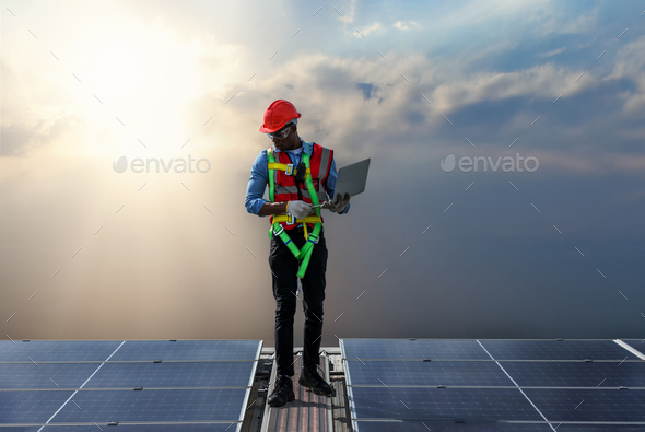 Engineer working setup Solar panel at the roof top. Stock Photo by kckate16
