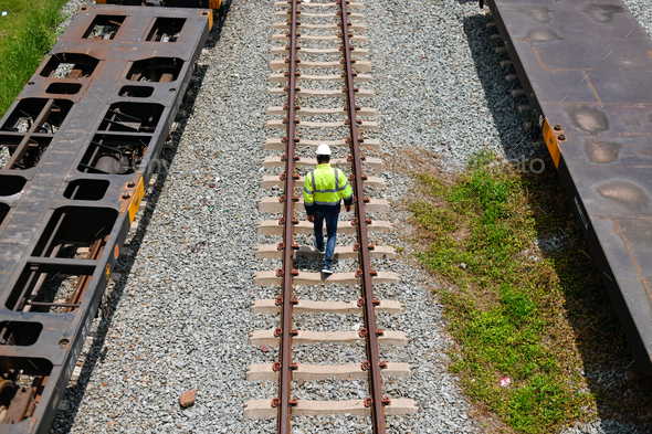 Engineer under inspection and checking construction process railway and ...