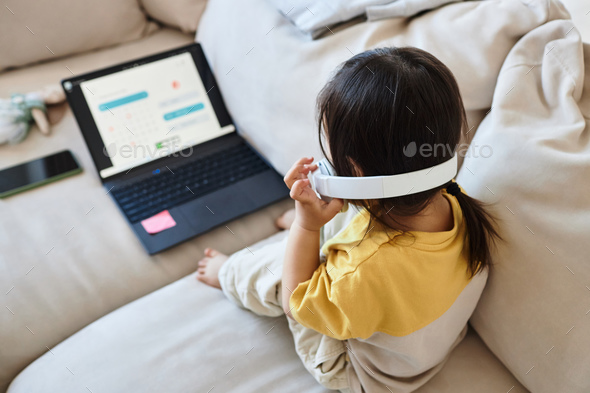 Little girl watching cartoon on laptop Stock Photo by AnnaStills ...