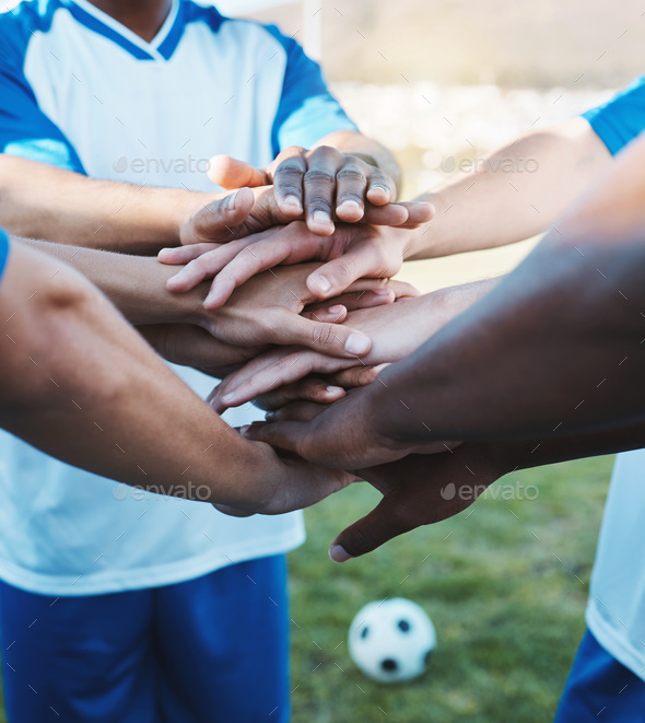 Hands stacked, sports and men on a soccer field for support, motivation ...