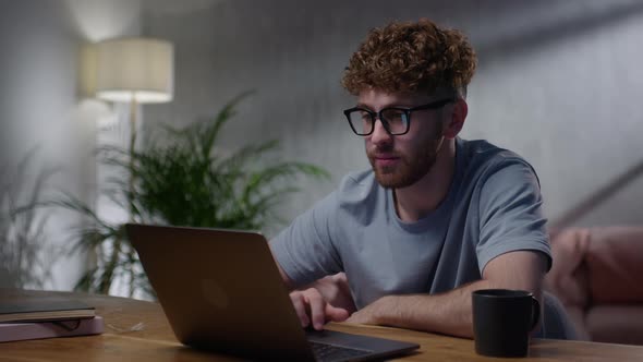 Portrait of Man Working at Night Looking at Monitor Reflections in ...