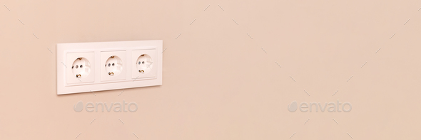 Electrical outlets on beige wall banner Stock Photo by Bykfa | PhotoDune