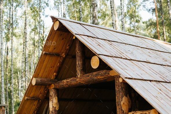 The structure of a wooden roof from a log house, exterior. Ancient ...