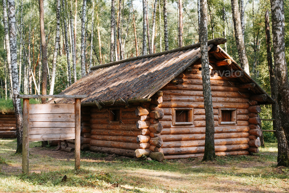 Wooden house from a log house in the forest. One-story old hut in the ...