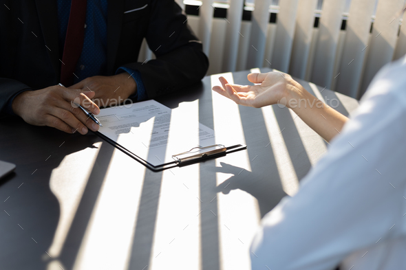 Employer in suit reading resume of job interview candidate profile ...