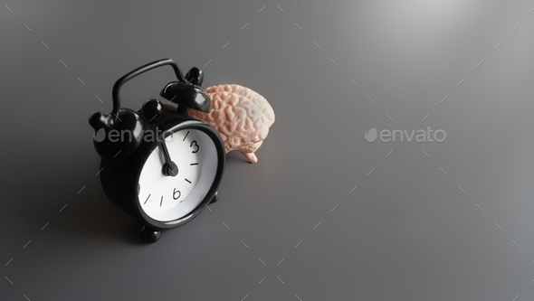 Brain and alarm clock with copy space. Stock Photo by mohdizzuanbinroslan