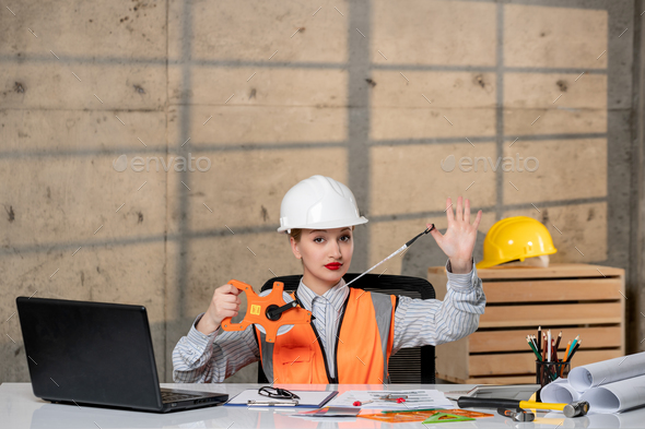 engineer smart young cute blonde girl civil worker in helmet and vest ...
