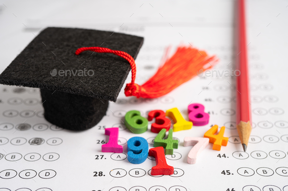 Graduation gap hat with math number and pencil on answer sheet Stock ...