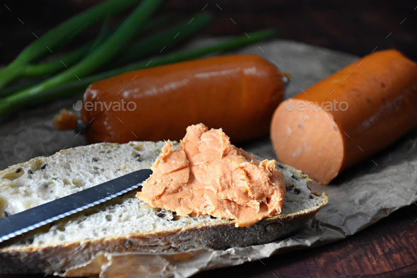 traditional german spreading sausage called Teewurst on slice of bread ...