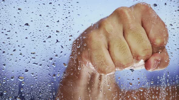 Hand Compressed Fist Hits Wet Window After Rain, Stock Footage | VideoHive