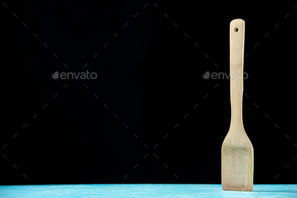 front view wooden spoon placed upright on dark background free space ...