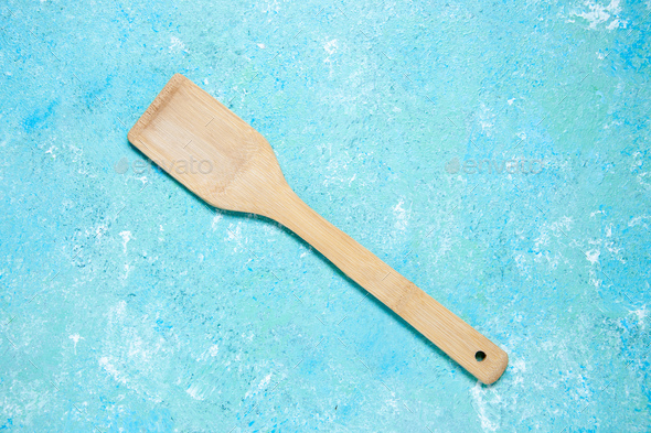 top view wooden spatula on blue background free space Stock Photo by ...