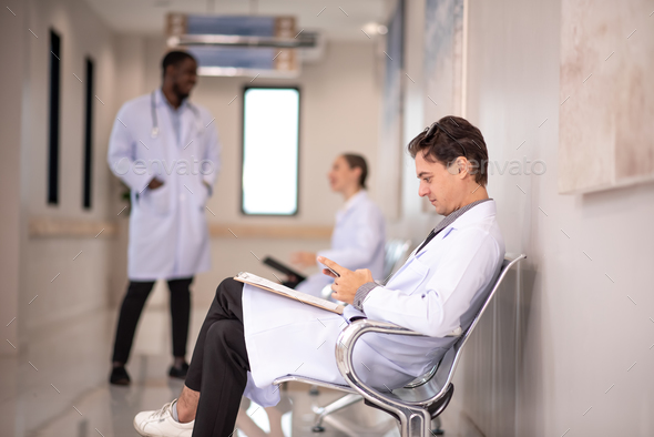 doctors talking in corridor at medical clinic, talking. Stock Photo by ...