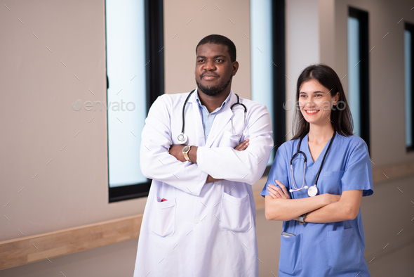 doctors talking in corridor at medical clinic, talking. Stock Photo by ...