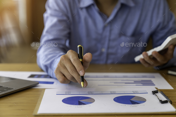 Business accounting concept, Business man using calculator with ...