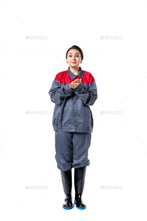 front view female builder in special uniform clapping on white ...