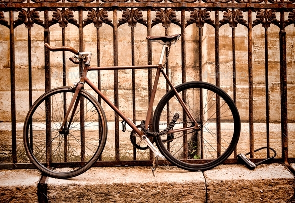 Old bicycle leaning on a railing Stock Photo by wirestock | PhotoDune