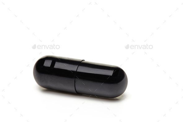Black herbal capsule, food supplement, vitamin pill, herbal medicine on ...
