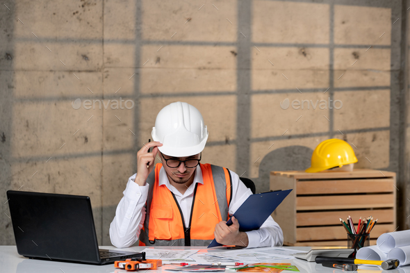 engineer smart young handsome cute guy civil worker in helmet and vest ...