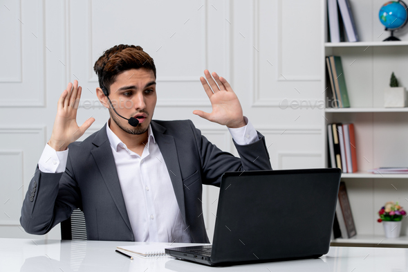 customer service young cute guy in grey office suit with computer ...