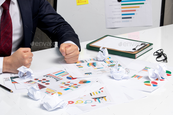 marketing gentleman at the office working with laptop doing commercial ...