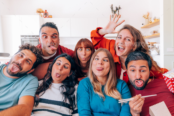 group of friends students making crazy faces together for a selfie ...