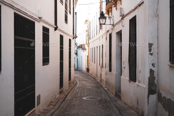 Alleyway with old white buildings under the blue sky Stock Photo by ...