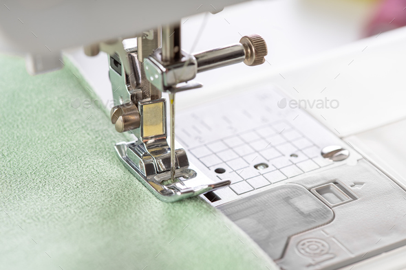 Modern Sewing Machine Presser Foot With Green Fabric And Thread ...