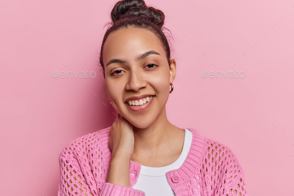 Portrait of lovely young Latin woman has tender expression dimples on ...