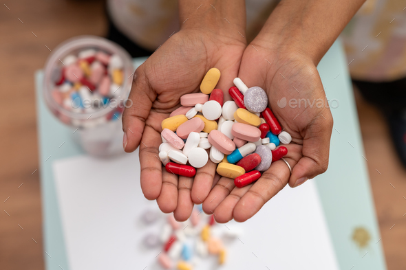 Close up shot of hand filled with capsules and tablets Stock Photo by ...