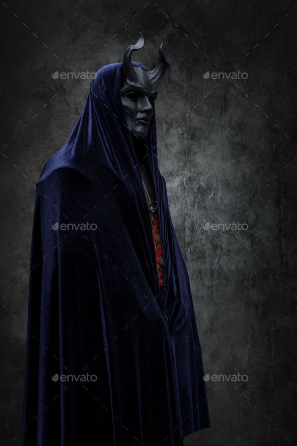 Evil cultist with dark cloak against dark background Stock Photo by ...